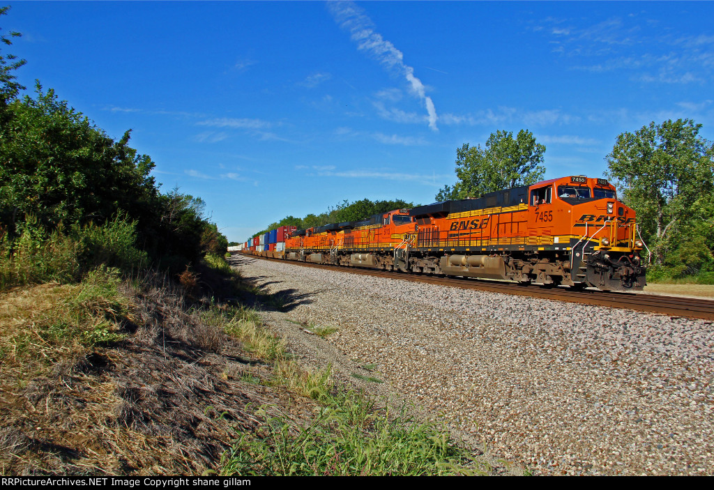 BNSF 7455 Rips a EB stack train out of La Plata Mo under Blue Skys!